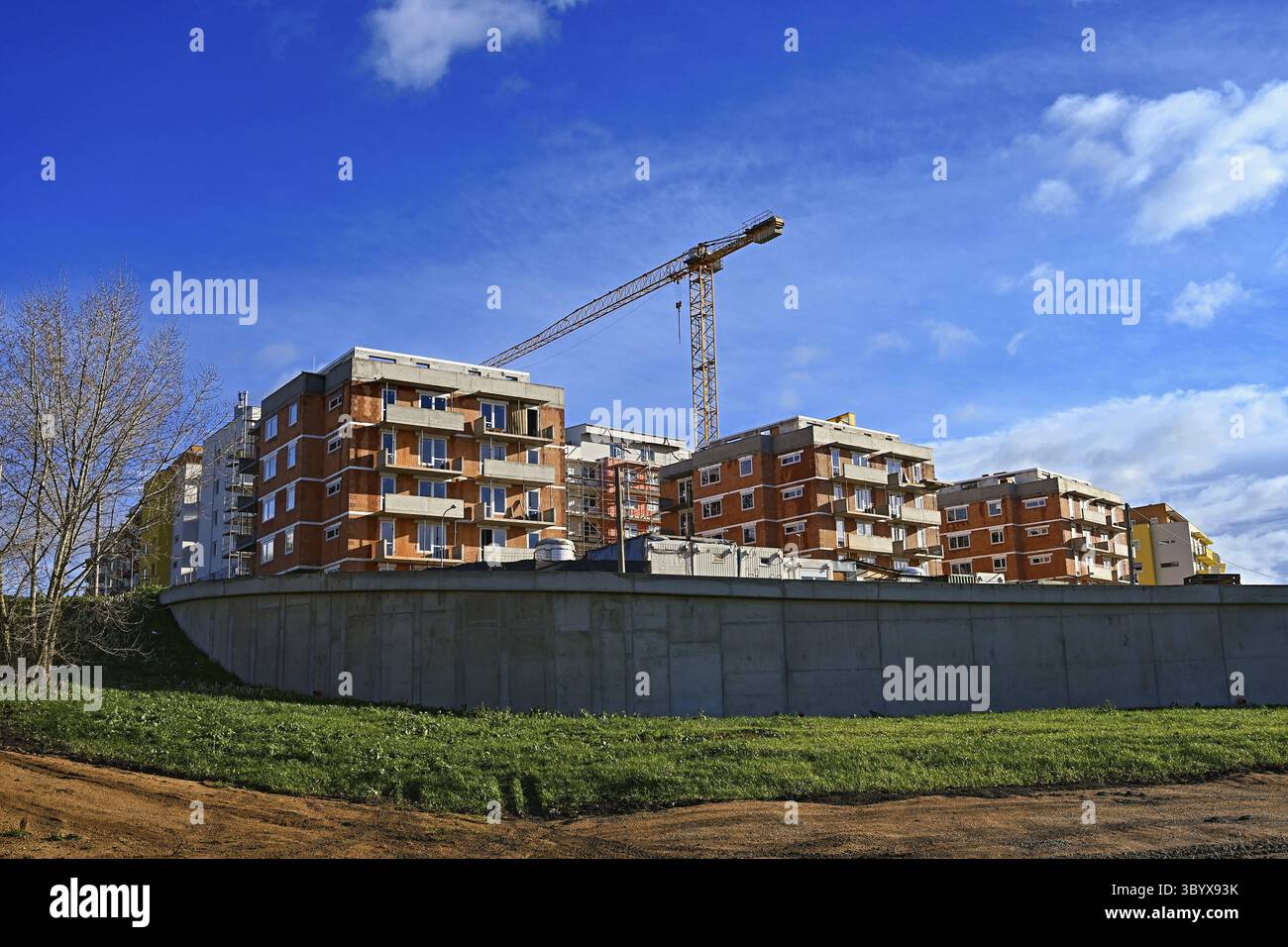 Construction of new homes. Concept for industry. Crane and blue sky ...