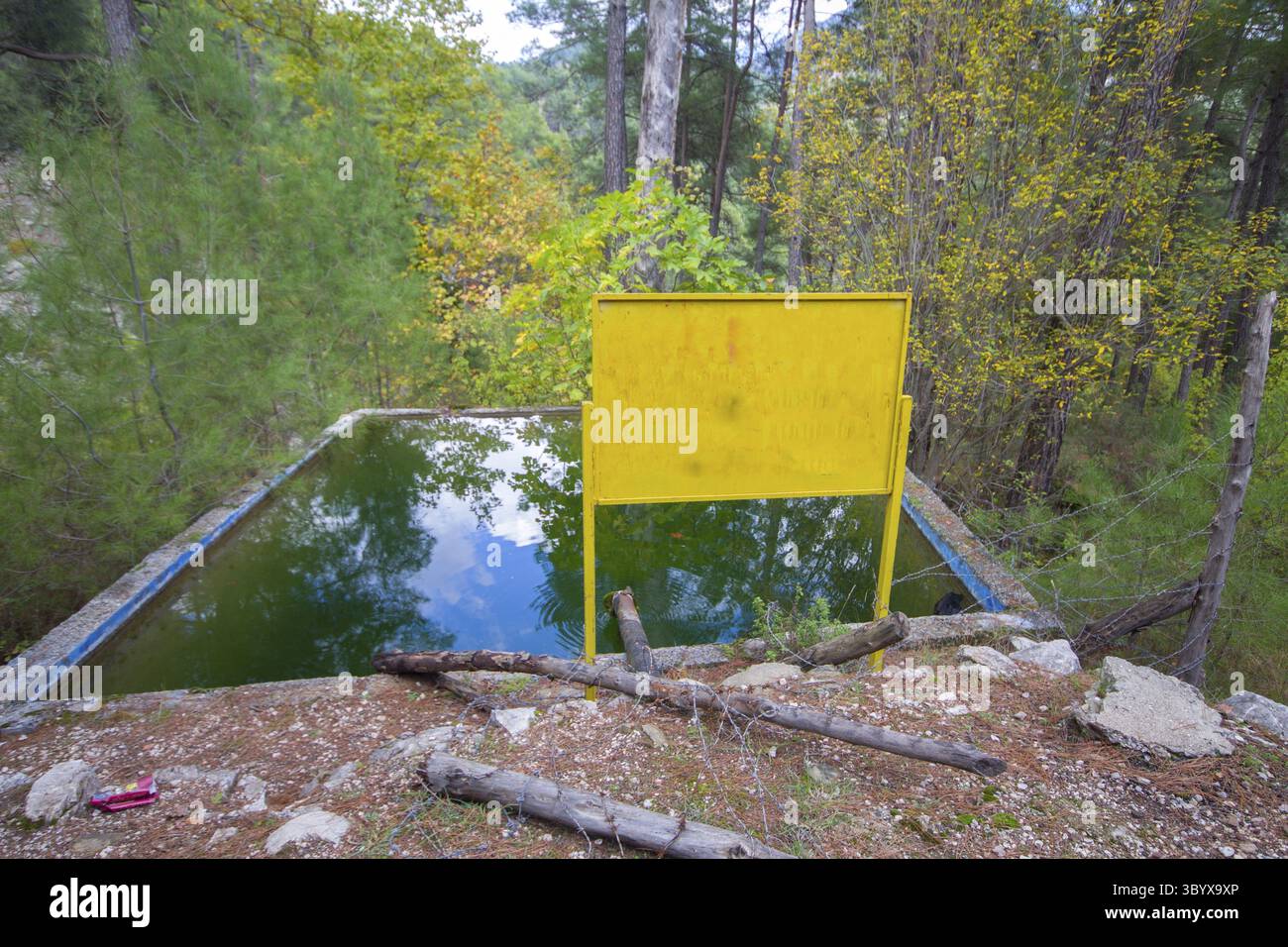 Water from mountains is going through pipes in pool Stock Photo - Alamy