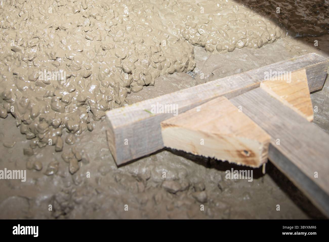 Leveling freshly poured concrete trowel hi-res stock photography and ...