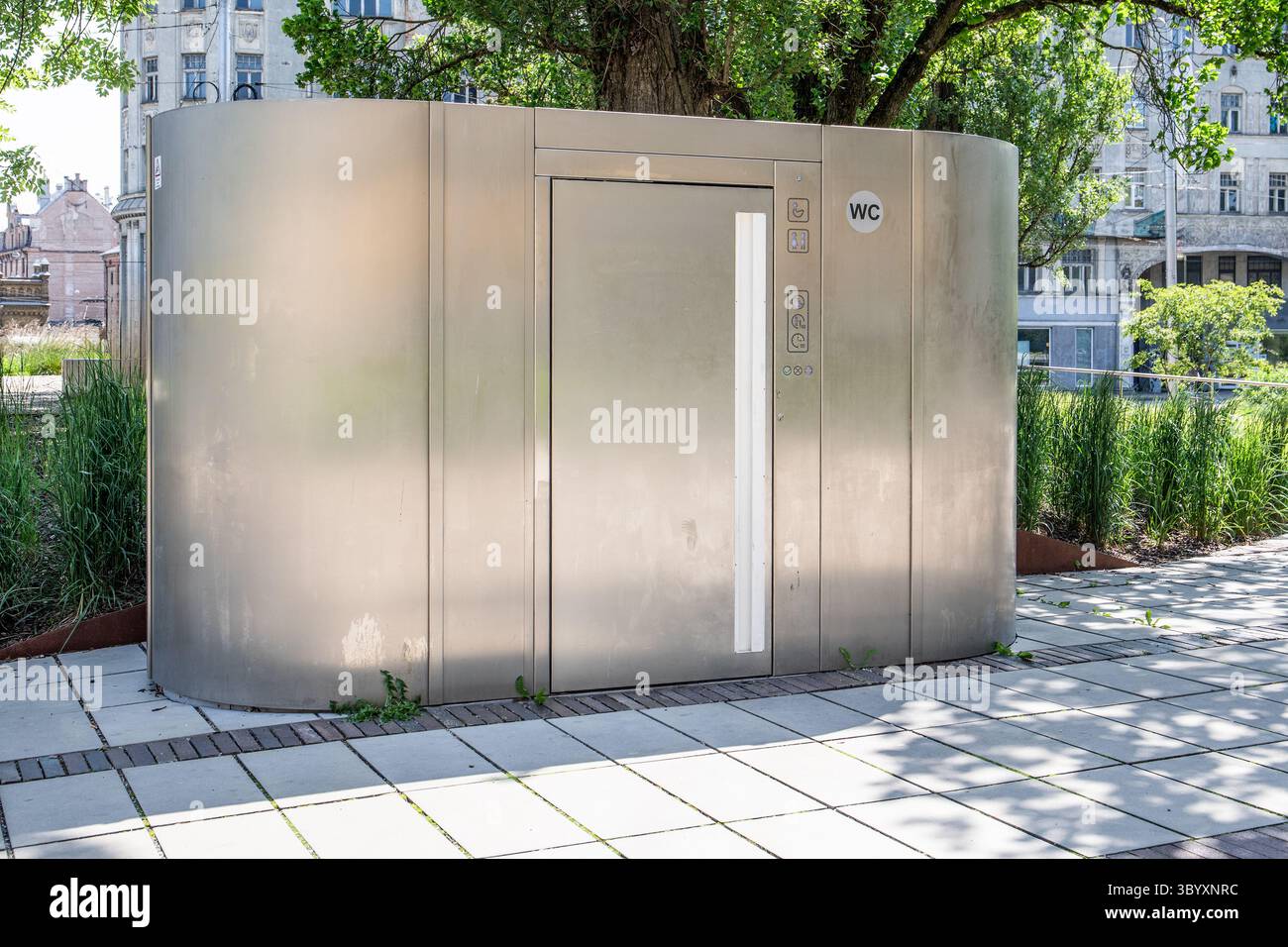Modern Public Restroom Facility with Stainless Steel Exterior in Urban ...