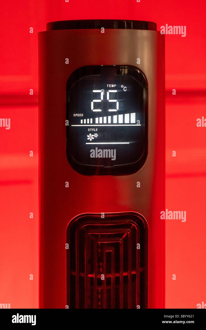 A fan on high speed with digital display, symbolising cooling on hot ...