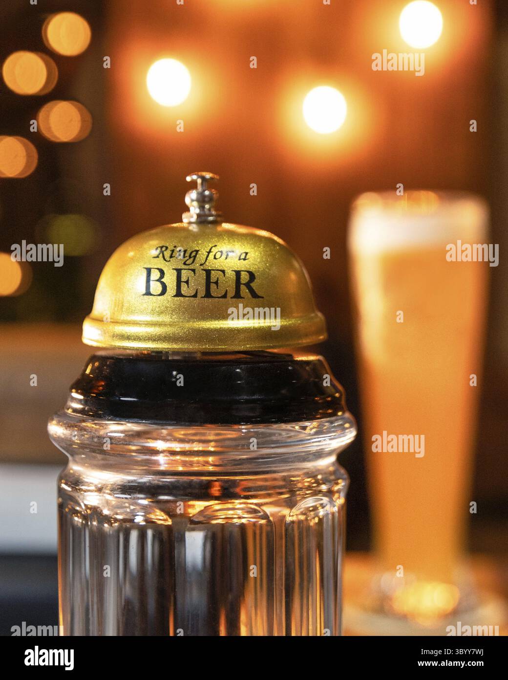 Ring for a beer with beer glass background Stock Photo - Alamy