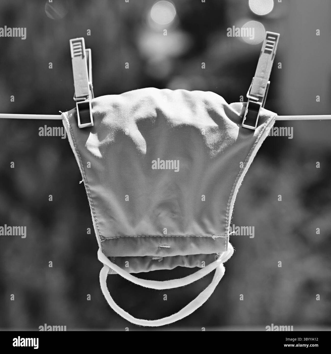 Face mask- respirator on a clothesline. Washing and disinfection ...