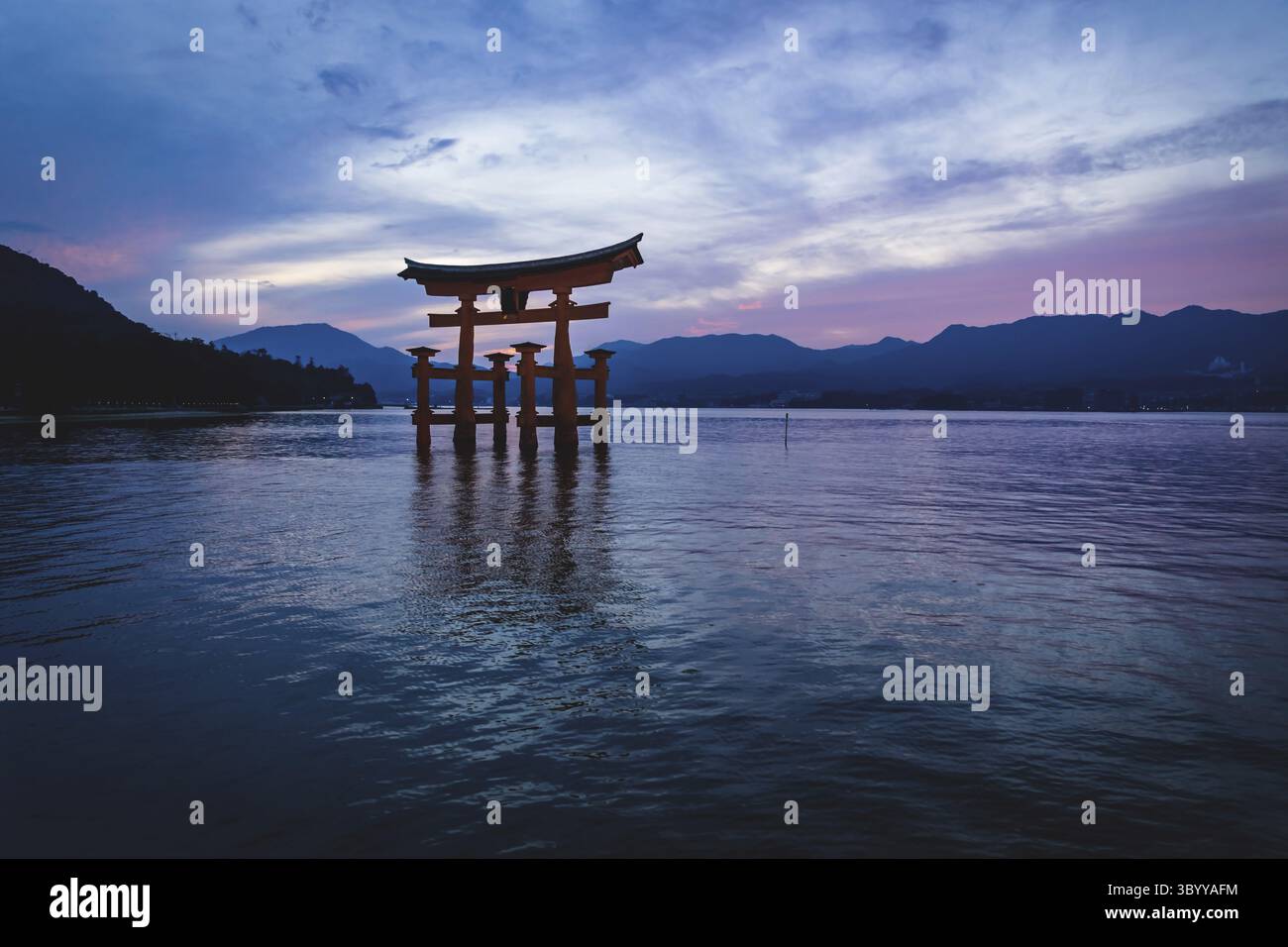 The floating Torii Gate of Itsukushima Shrine in ocean waves after ...