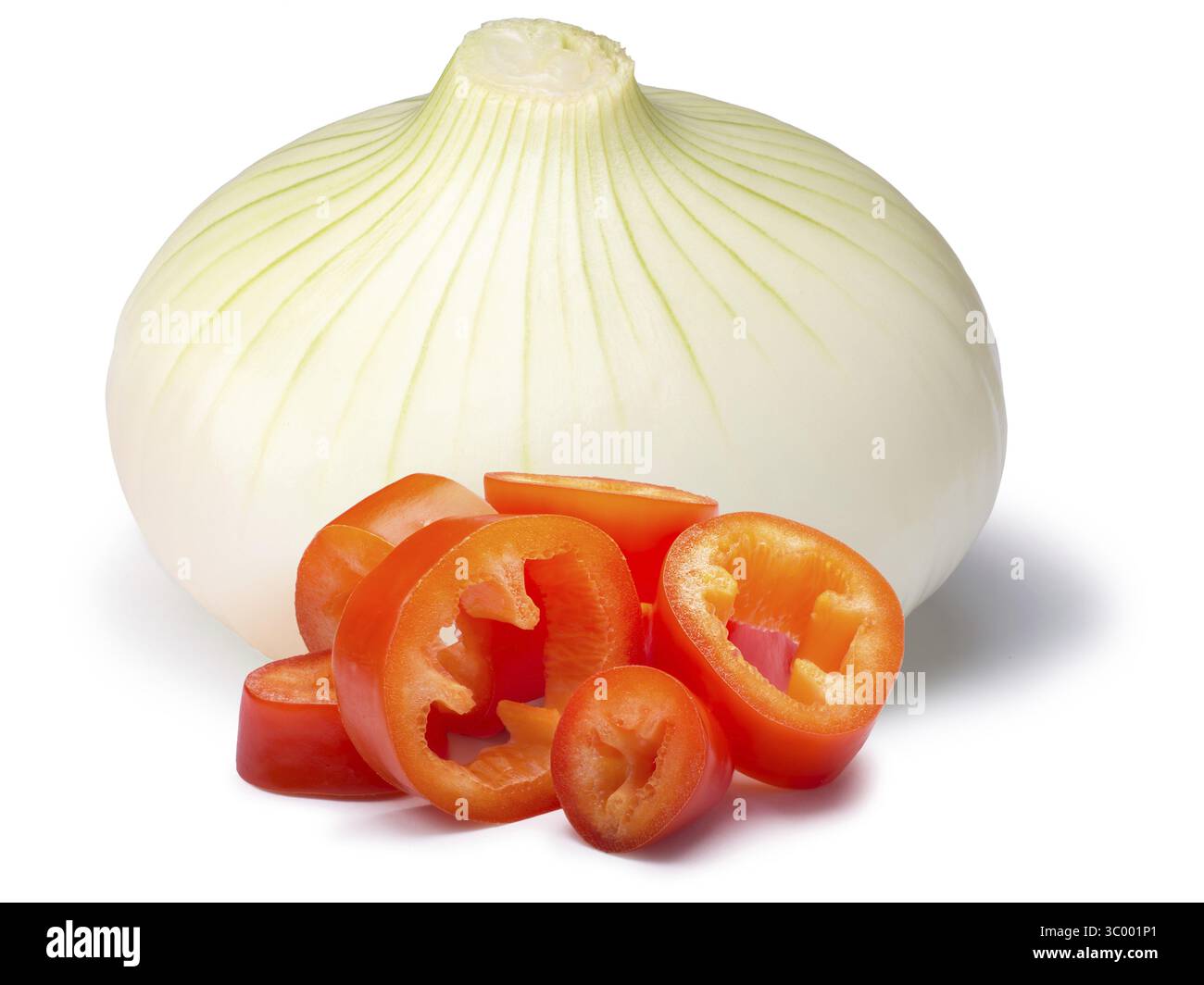 Chopped Paprika or Hot Wax chile next to white peeled onion bulb ...