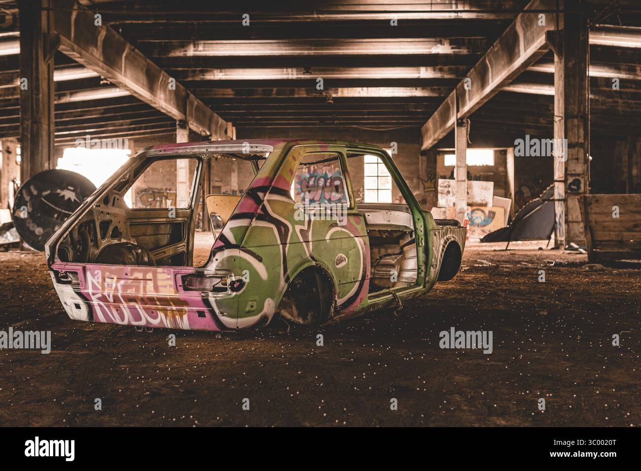 An old abandoned industrial area, with lots of graffiti that is slowly ...
