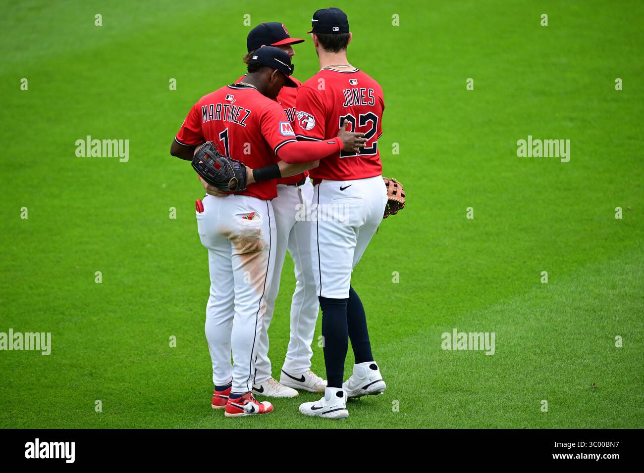 Cleveland Guardians right fielder Daniel Schneemann, left, right ...