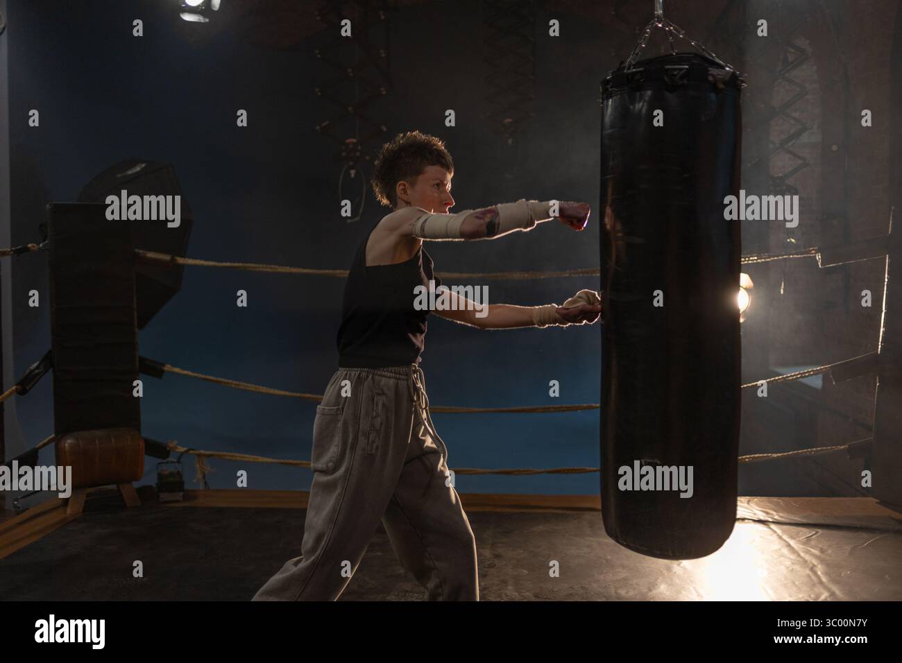 Boxing with a punching bag, sports achievements concept, female ...