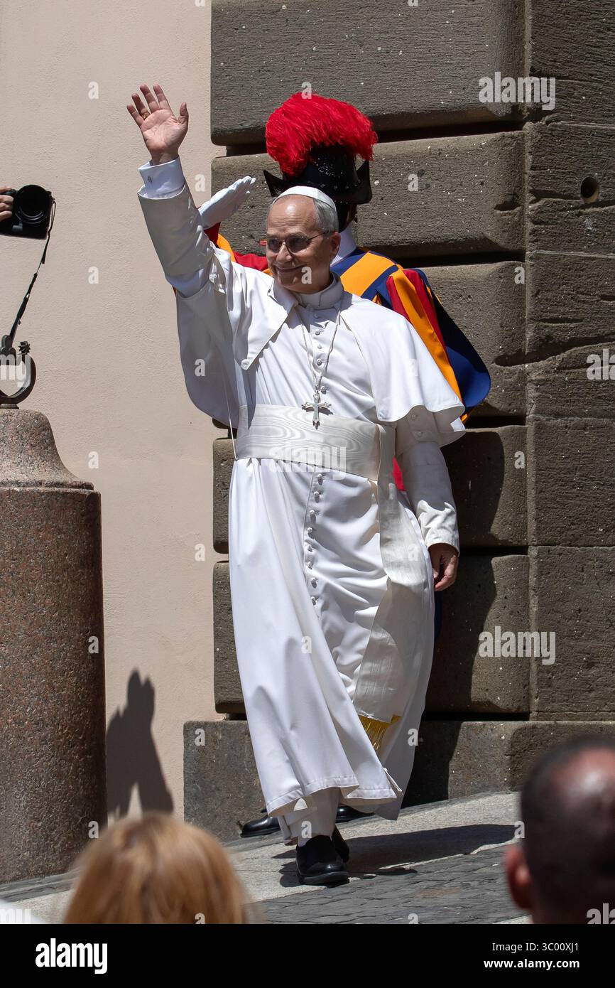 Pope Leo XIV waves the crowd at the end of the Angelus prayer from the ...