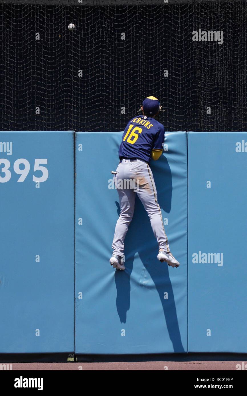 Milwaukee Brewers center fielder Blake Perkins can't get to a ball hit ...