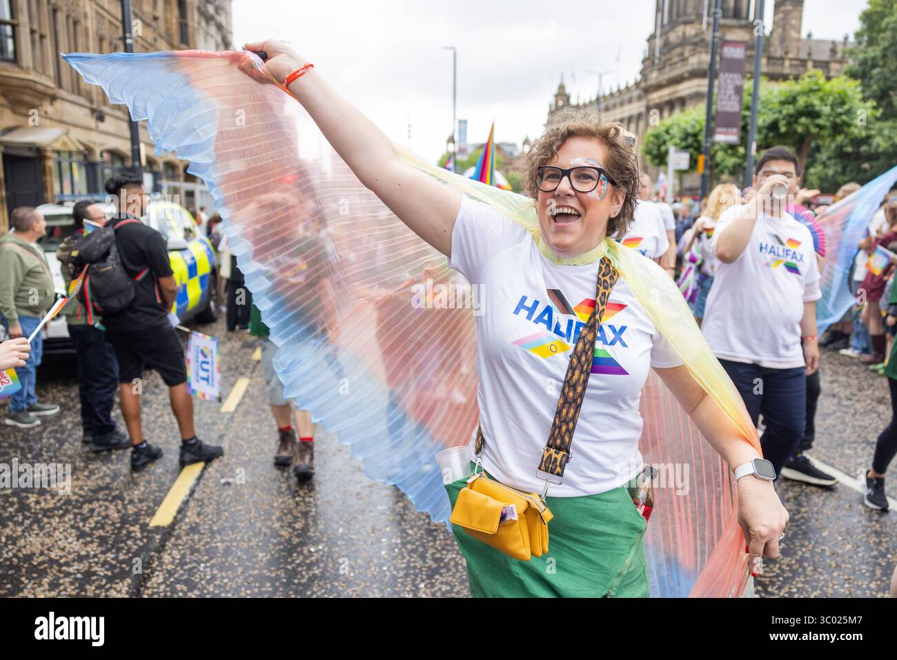 Leeds, UK. 20 JUL, 2025. Person from Halifax poses with trans flag wing ...