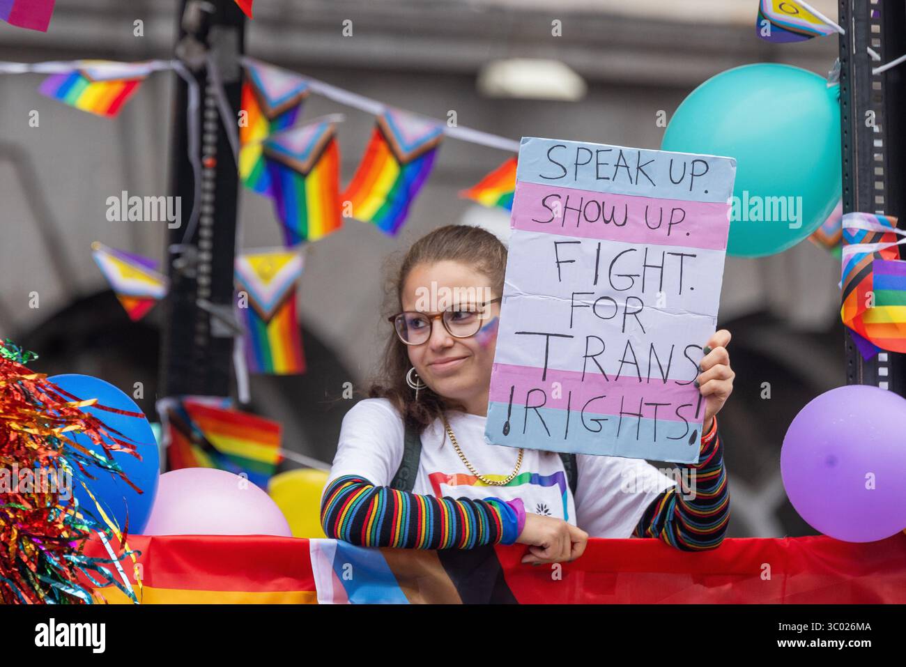 Leeds, UK. 20 JUL, 2025. Person holds "Speak Up, Show up, fight for ...