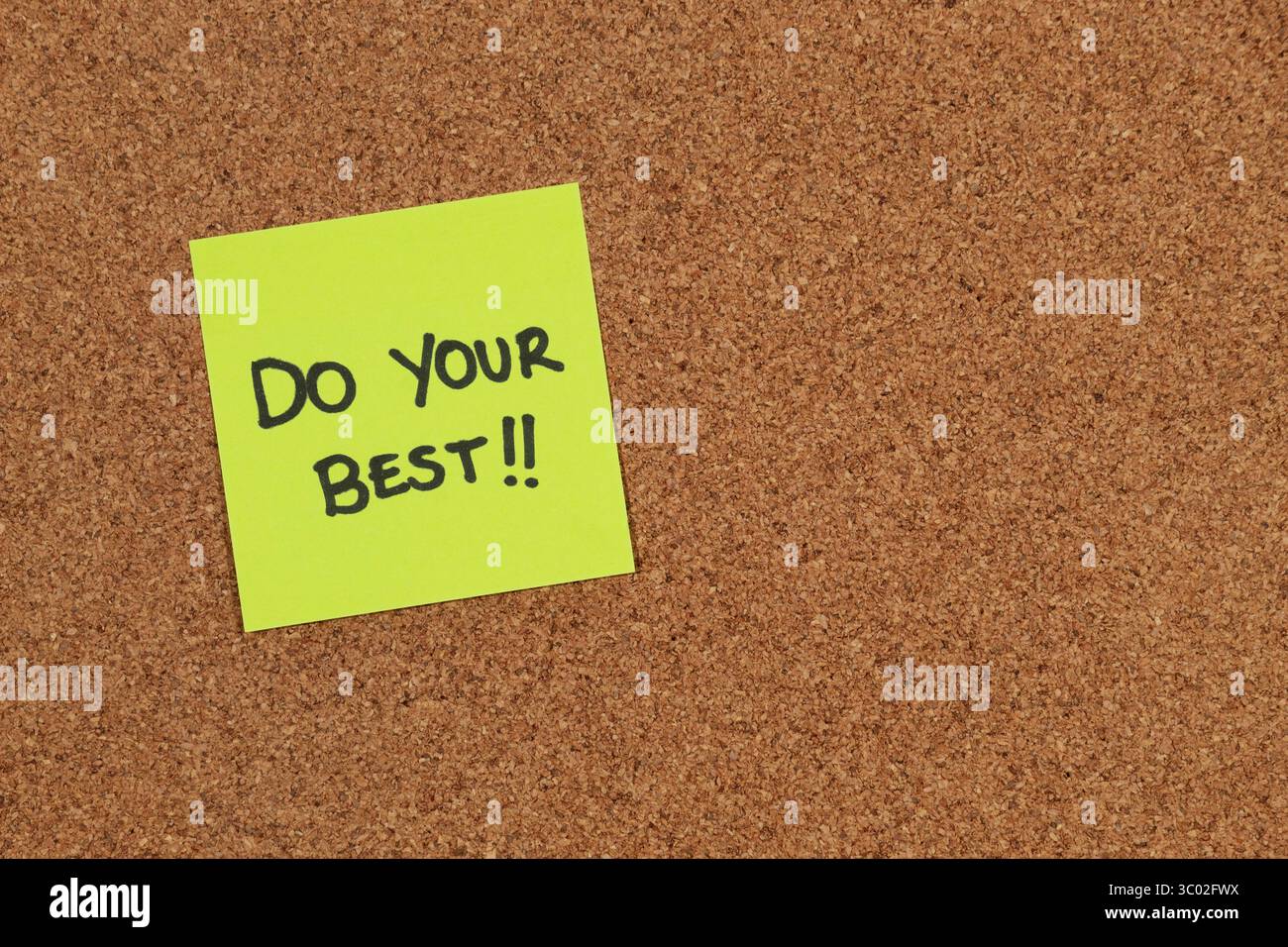 Close up to a sticky note with "do your best" positive motivational ...