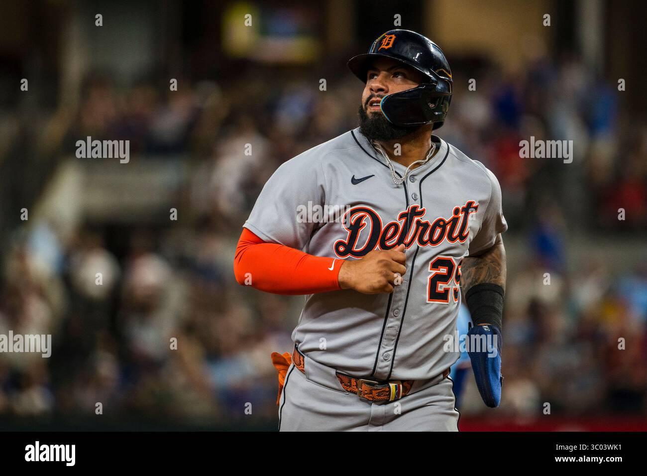Detroit Tigers' Gleyber Torres looks at a replay while jogging to the ...