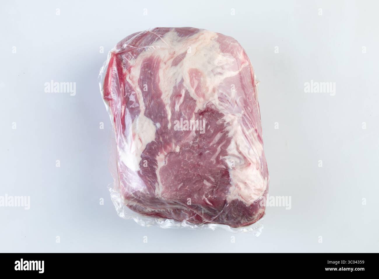 Red meat wrapped in plastic isolated nature background with clipping ...