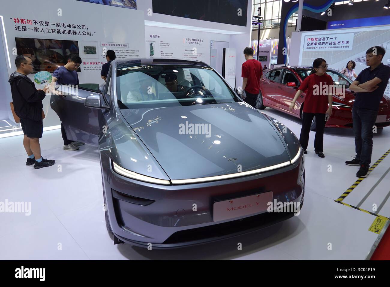 Tourists visit at TESLA booth at the 3rd China International Supply ...