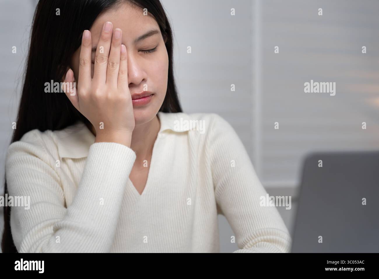 Eye problems, Asian women with tired and irritated eyes, eye rubbing ...