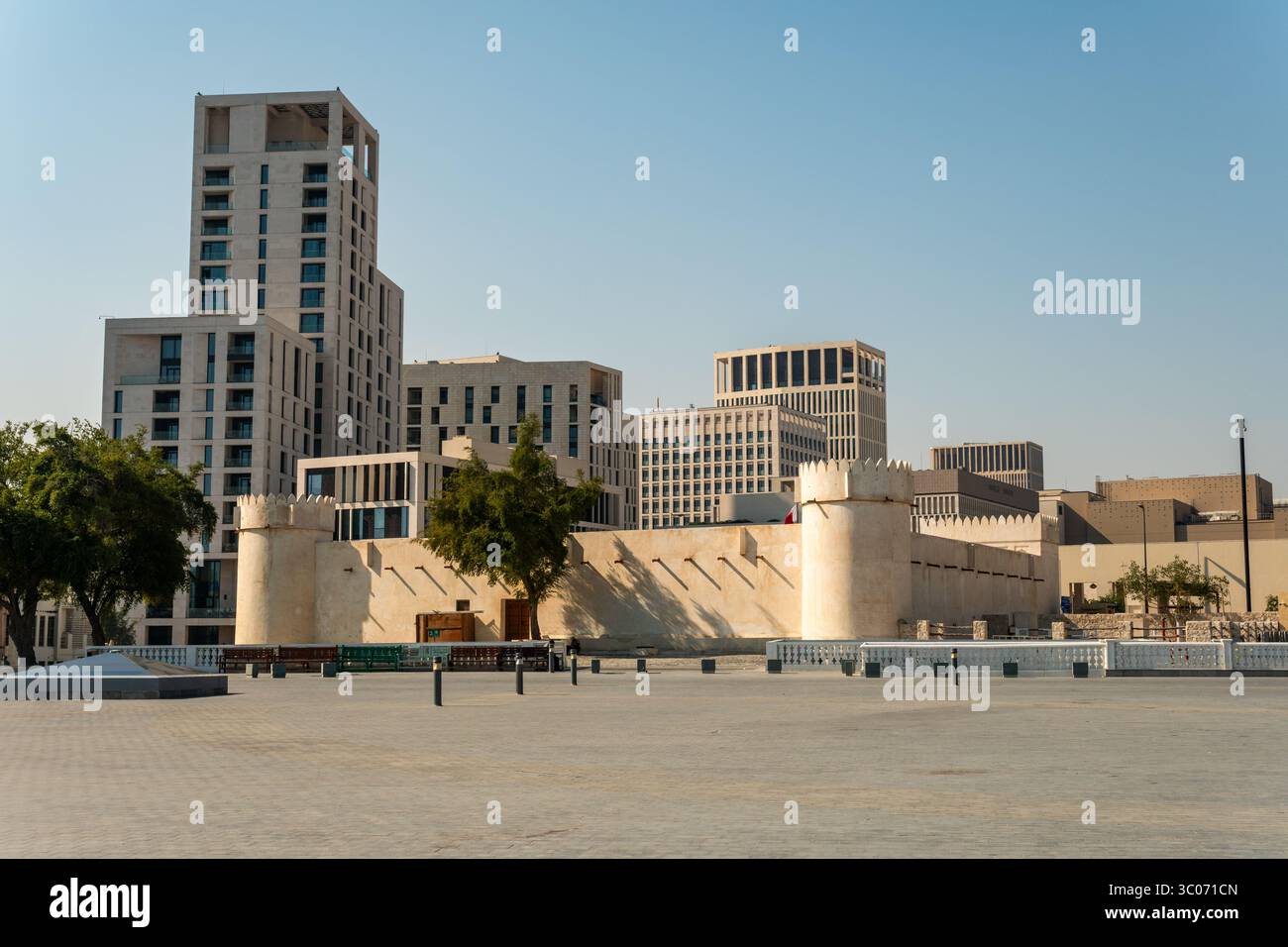 Al Koot Fort at Doha, Qatar. Vintage white Ford with flag of Qatar on a ...