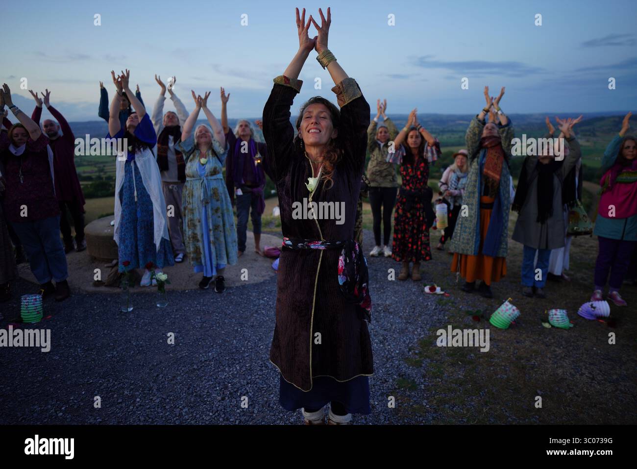 People surround Magdalene Rose Priestess, Chloe Mercer on the ...