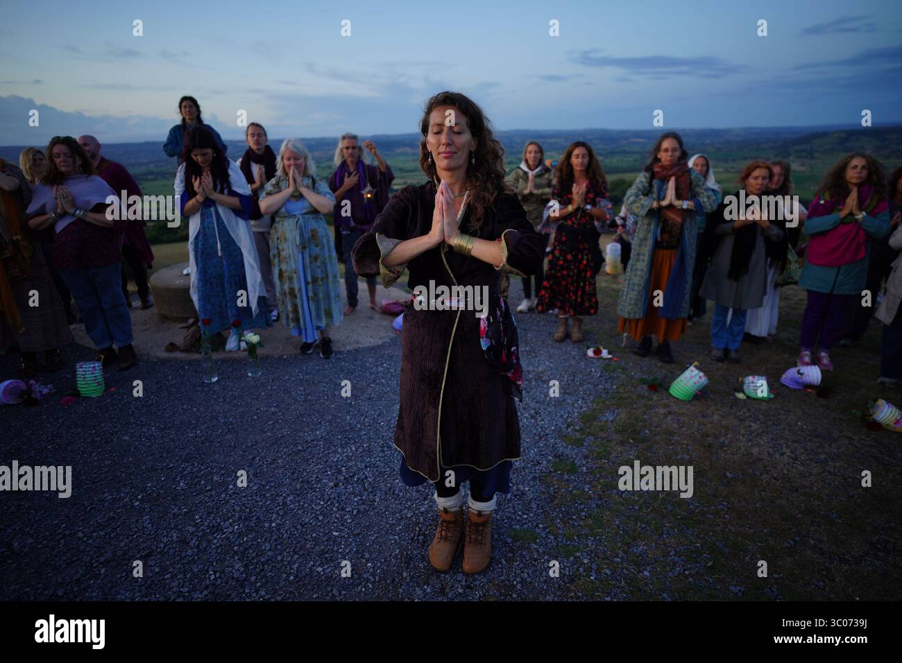 People surround Magdalene Rose Priestess, Chloe Mercer on the ...