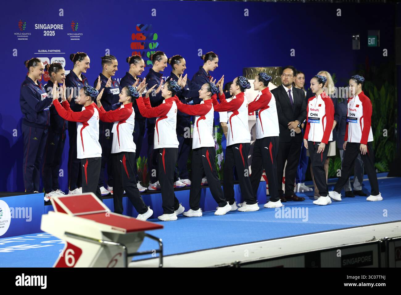 Before the award ceremony, the Chinese team high-fived with Spain's ...