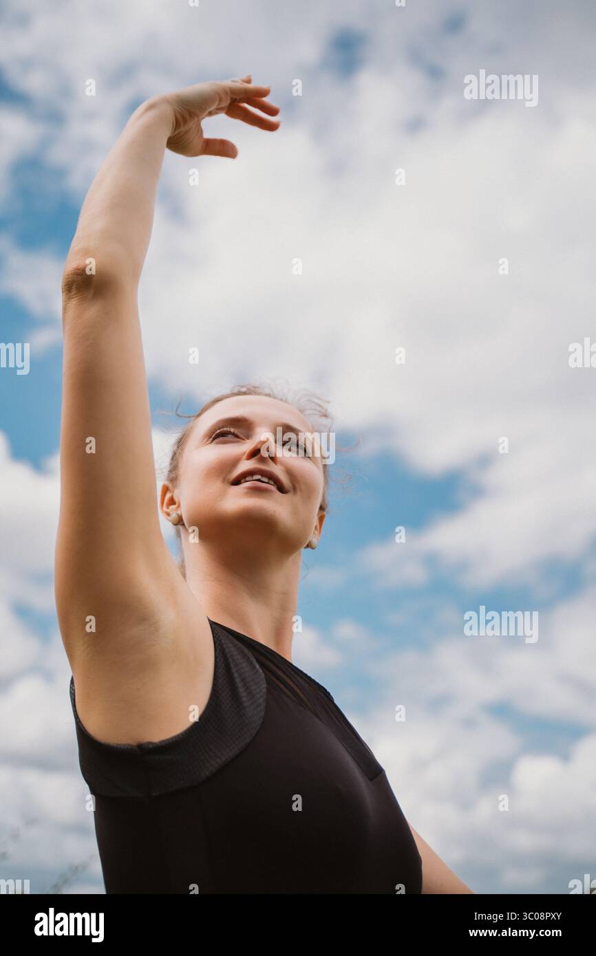 Woman stretches calm expression hi-res stock photography and images - Alamy