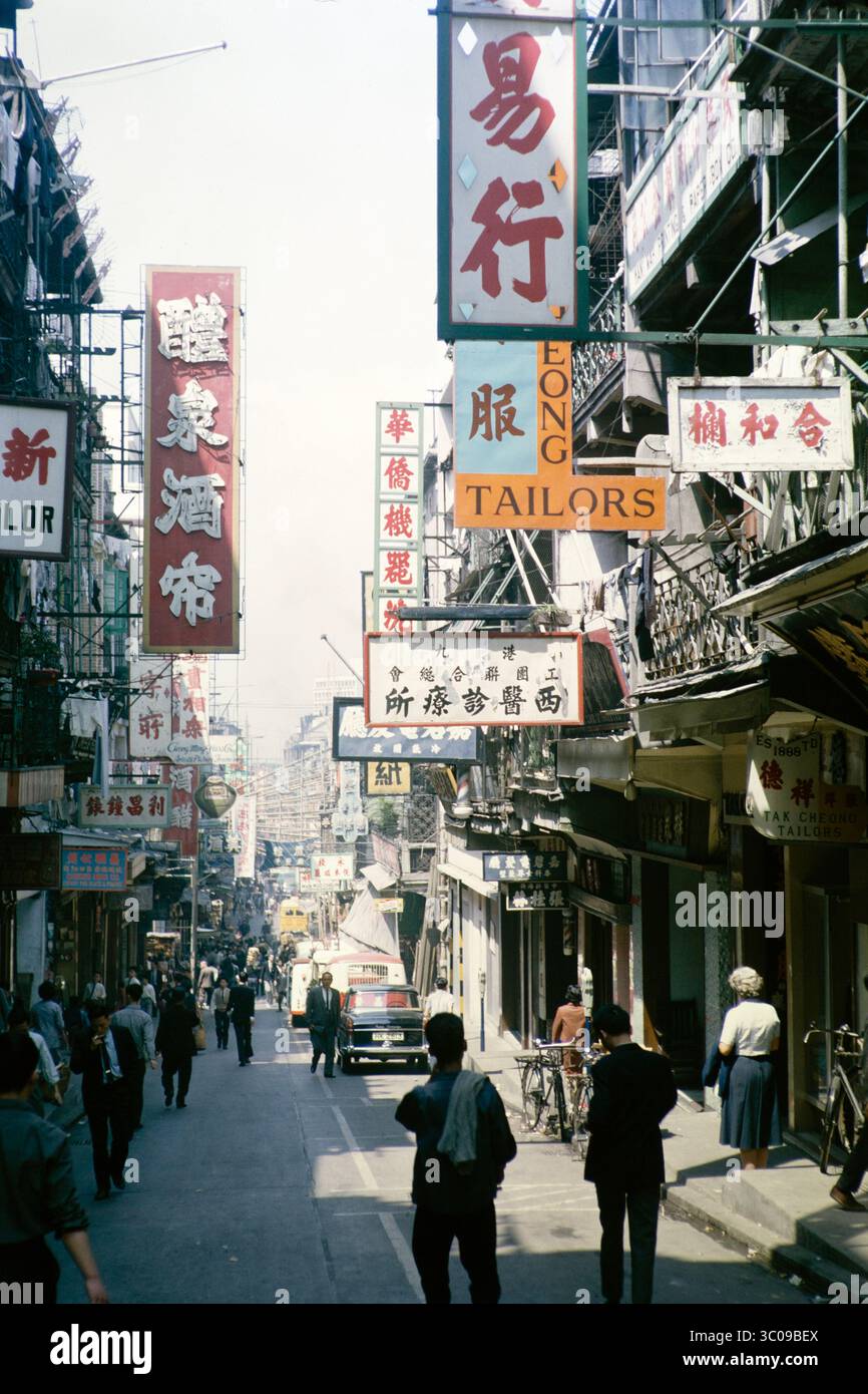 Busy street of shops and signs in English and Mandarin including for ...