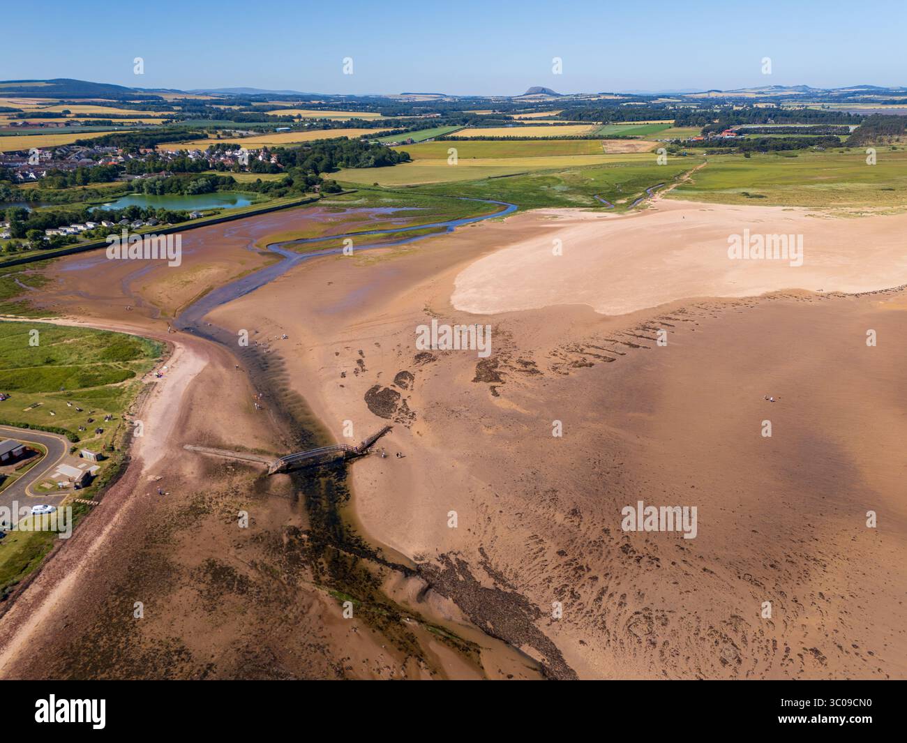 Aerial view of winding waterways carve through the sandy expanse near ...