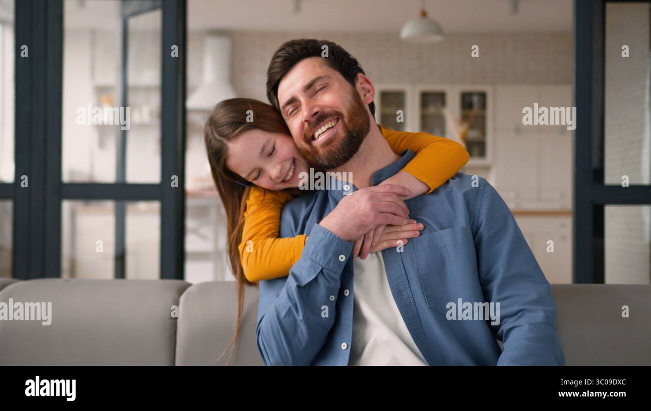 Playful little Caucasian daughter child surprise dad man cheerful ...