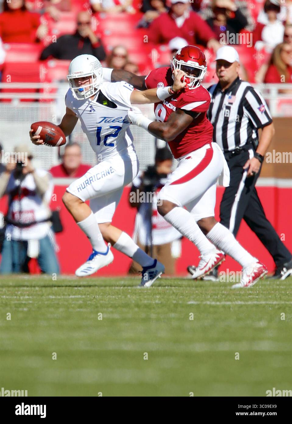 Oct 20, 2018: Tulsa QB Seth Boomer #12 works to fight off Arkansas ...