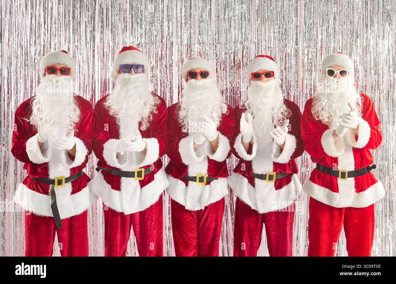 Portrait Of Happy Santas Applauding At Christmas Party Stock Photo - Alamy