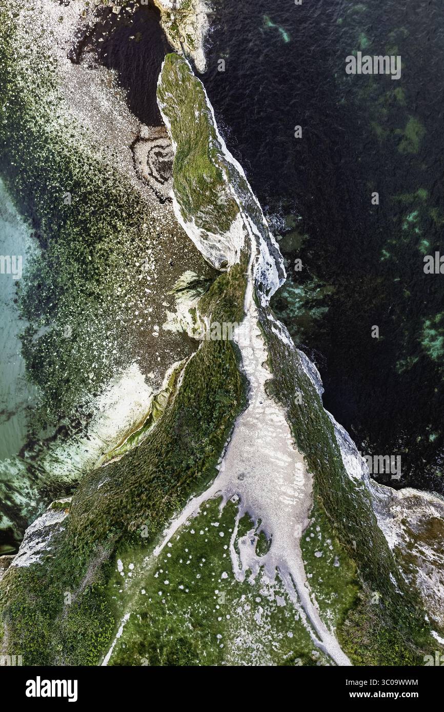Aerial view of the rugged South West Coast Path where chalk cliffs meet ...