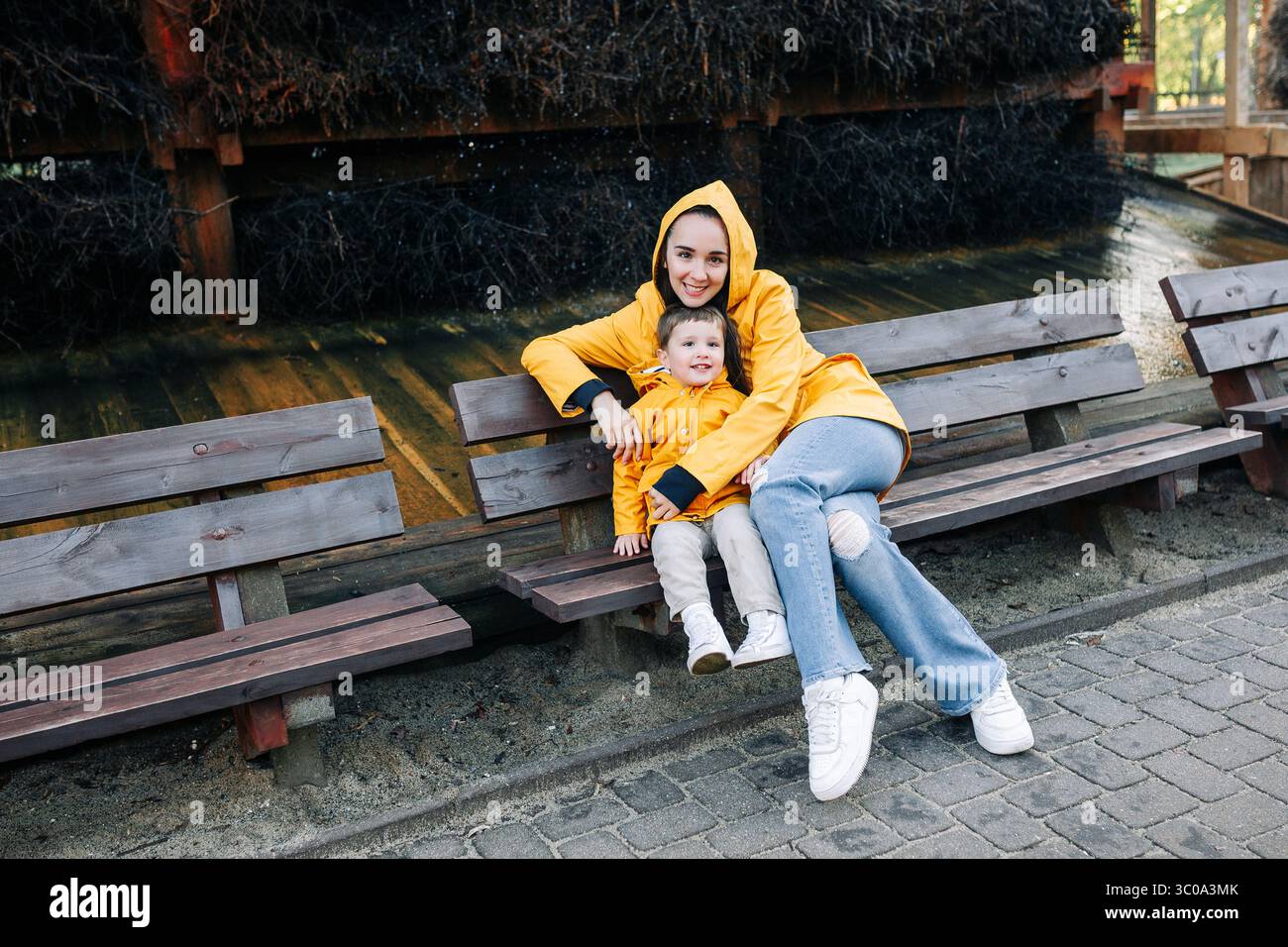 Smiling child in raincoat hi-res stock photography and images - Alamy
