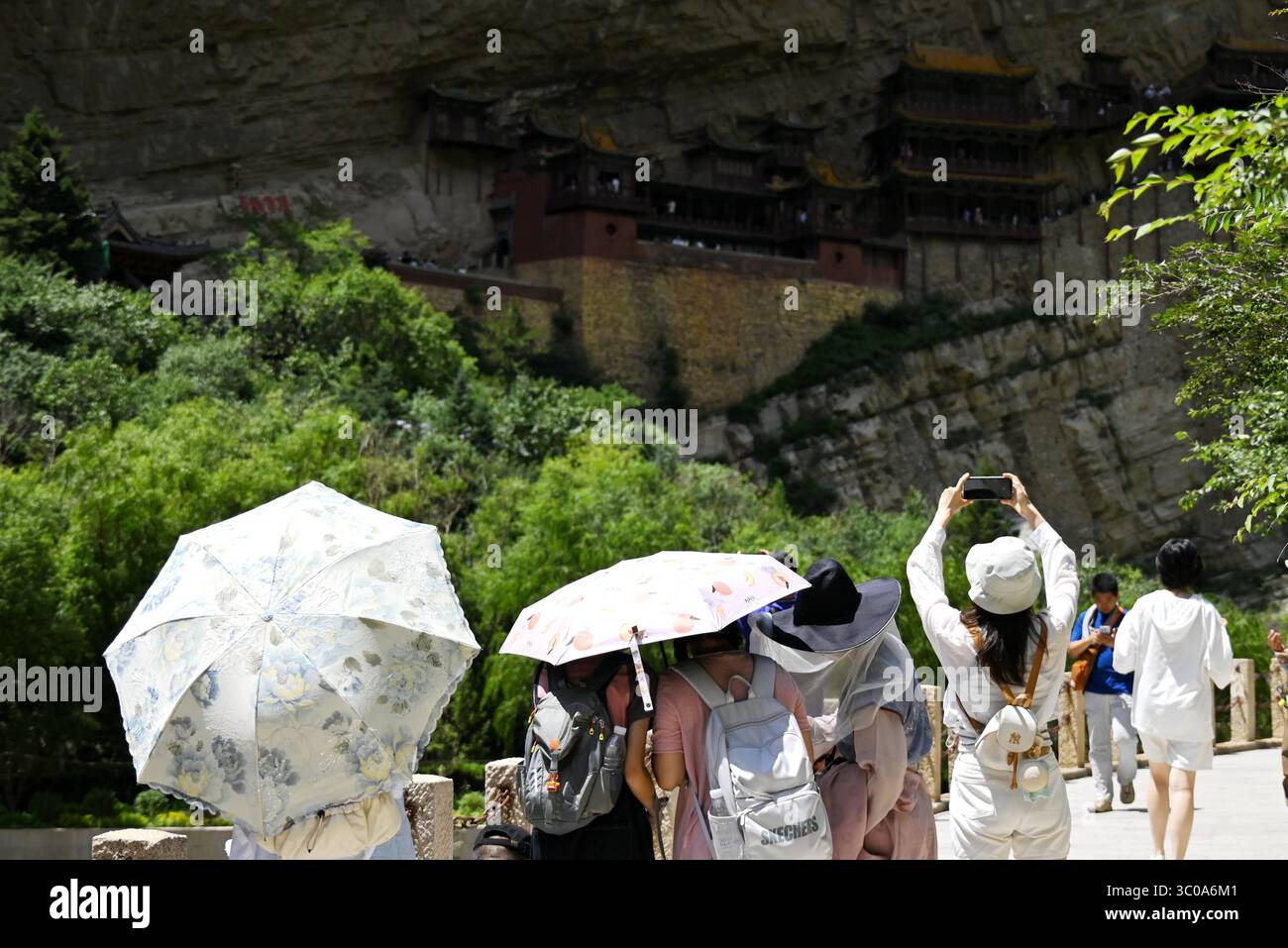 People visit the Xuankong Temple in Datong City, north China's Shanxi ...