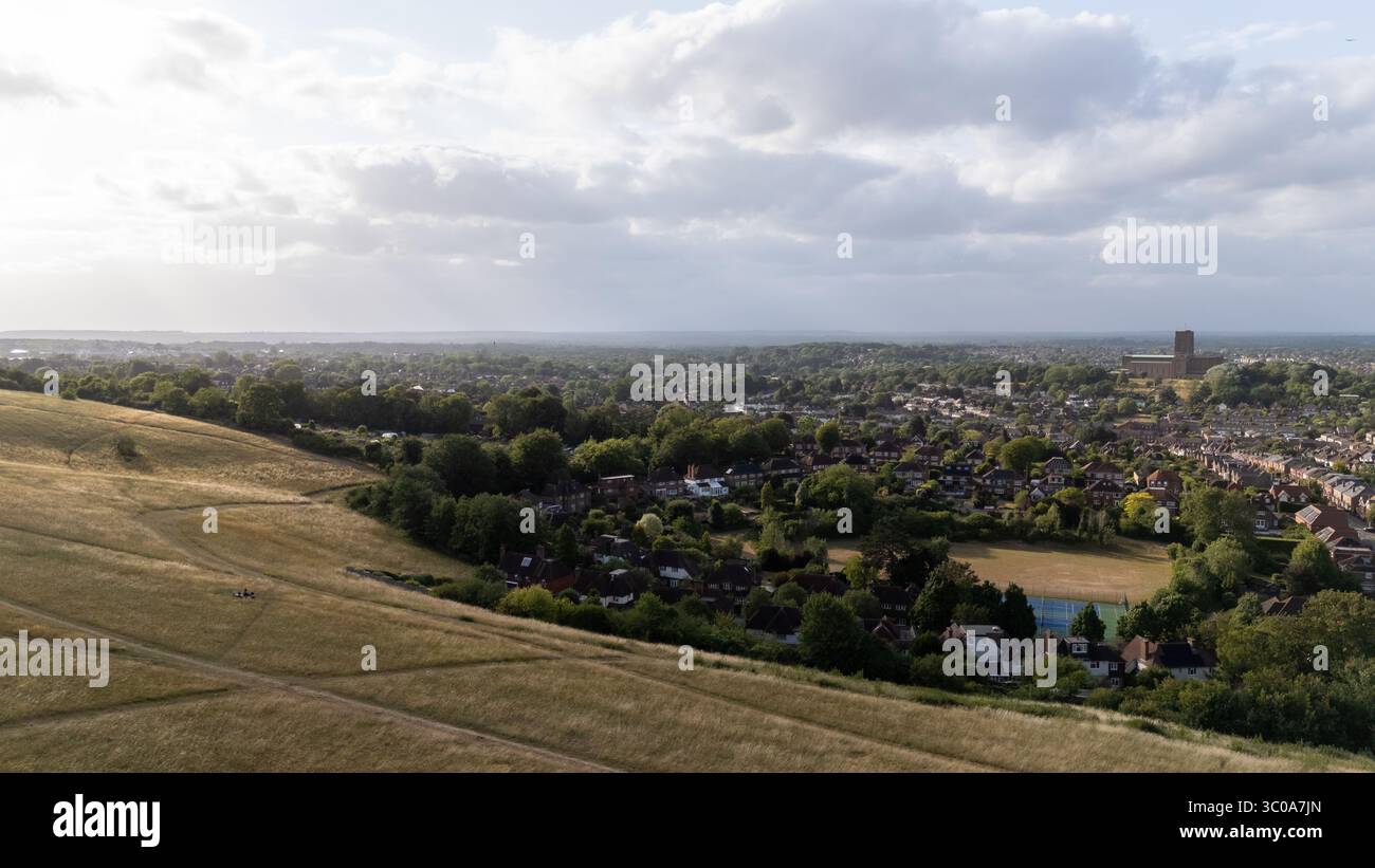 Aerial view of the golden hillside descends towards the historic ...