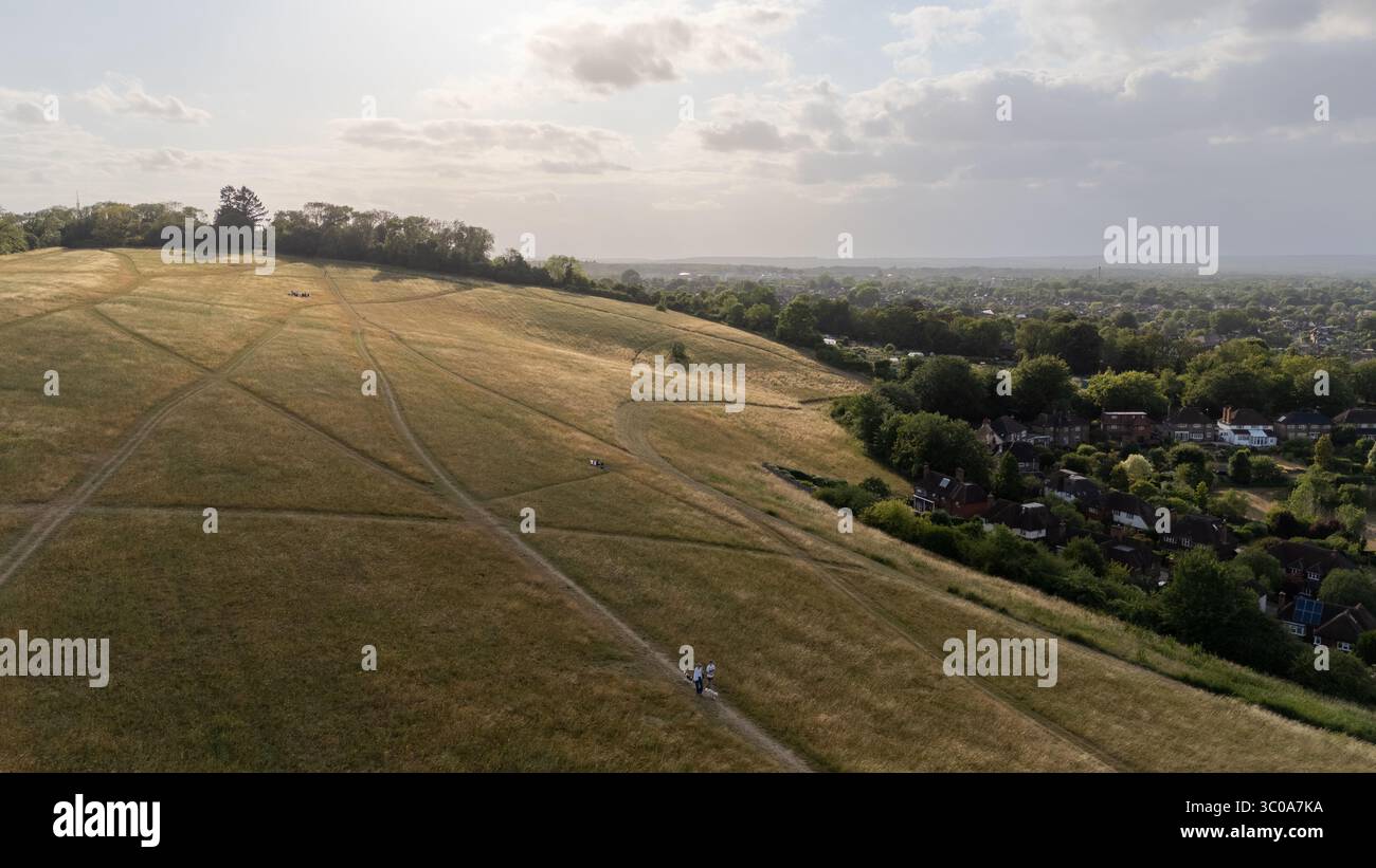 Aerial view of golden sunlight bathing the grassy slopes of The Mount ...