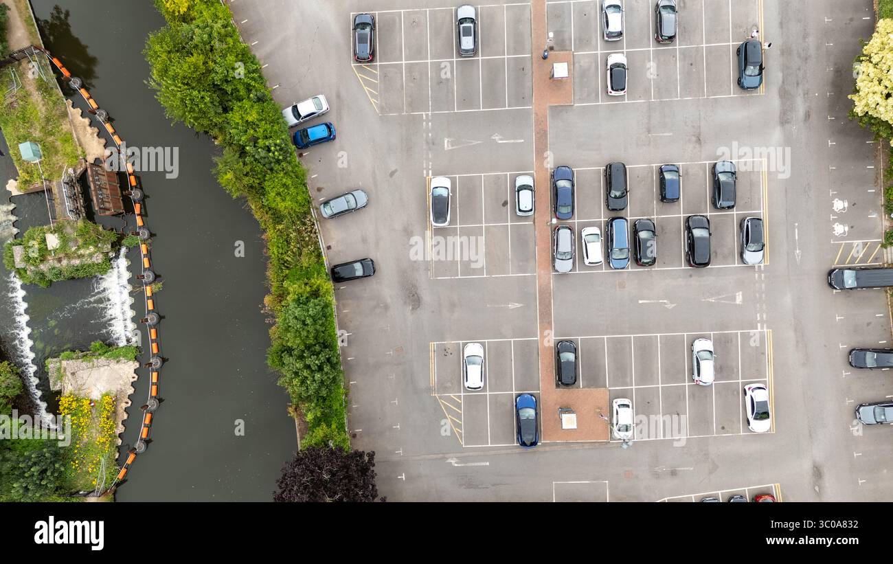 Aerial view of a tranquil river reflecting the sky contrasting with the ...