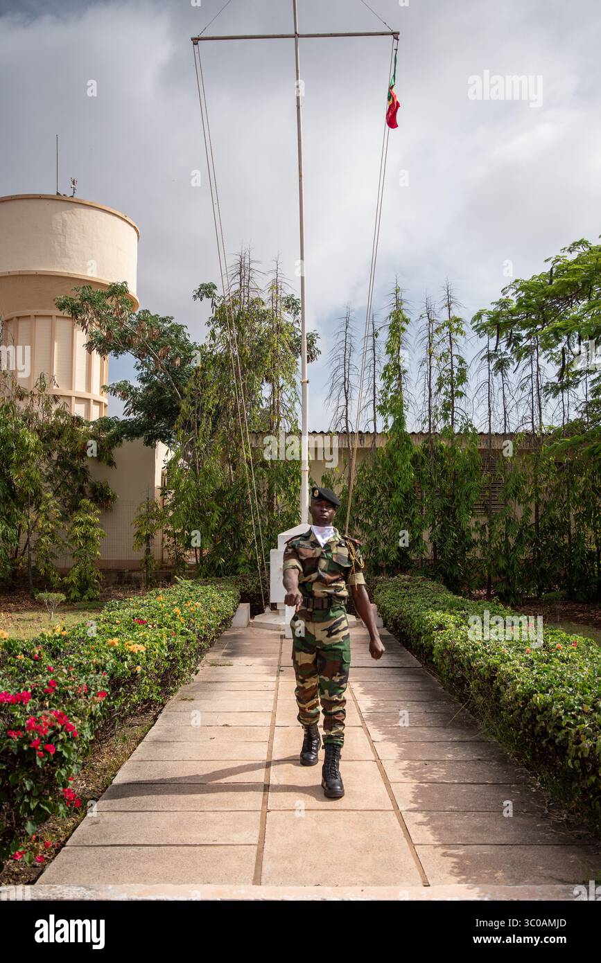 A Senegalese soldier marches in step after hoisting the Senegalese flag ...