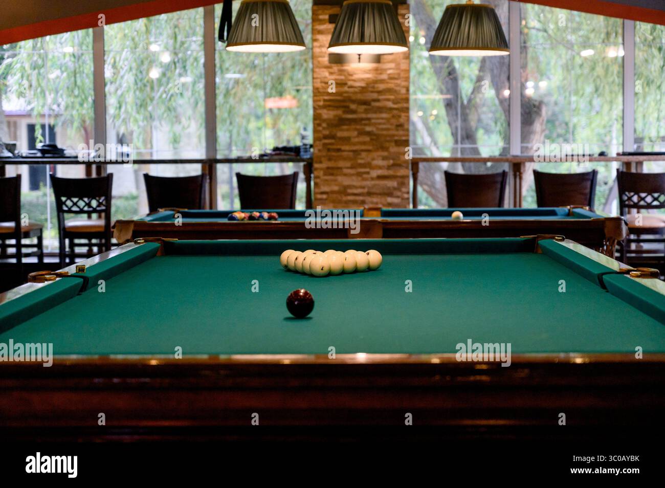 Billiard Table with balls and cue.billiard tables in the room without ...