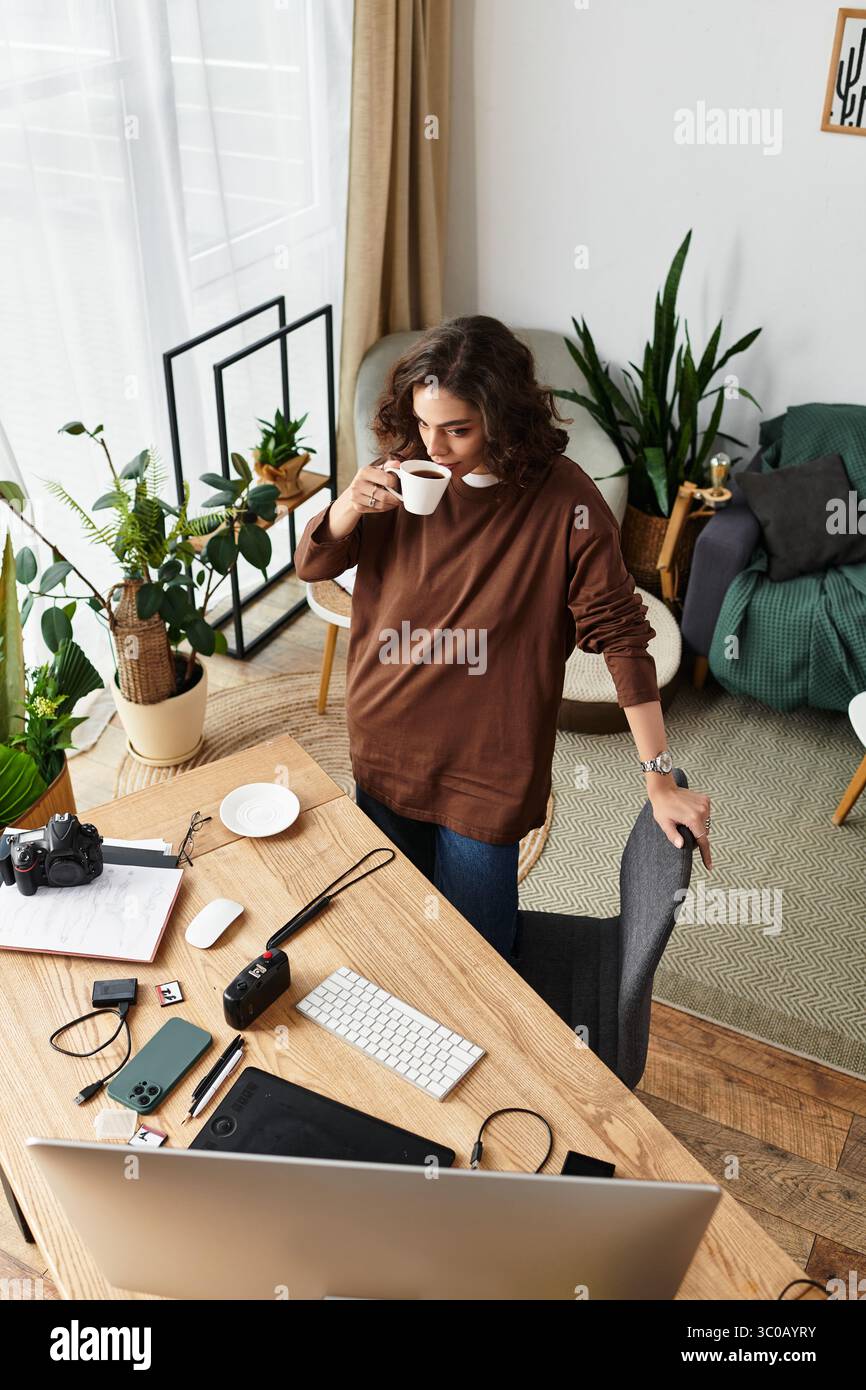 Curly haired woman sips hi-res stock photography and images - Alamy