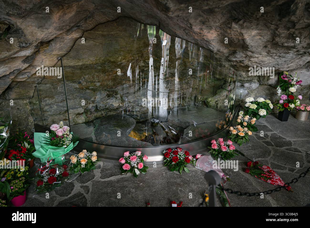 flowers at the Massabielle Grotto in Lourdes, France, Europe Stock ...