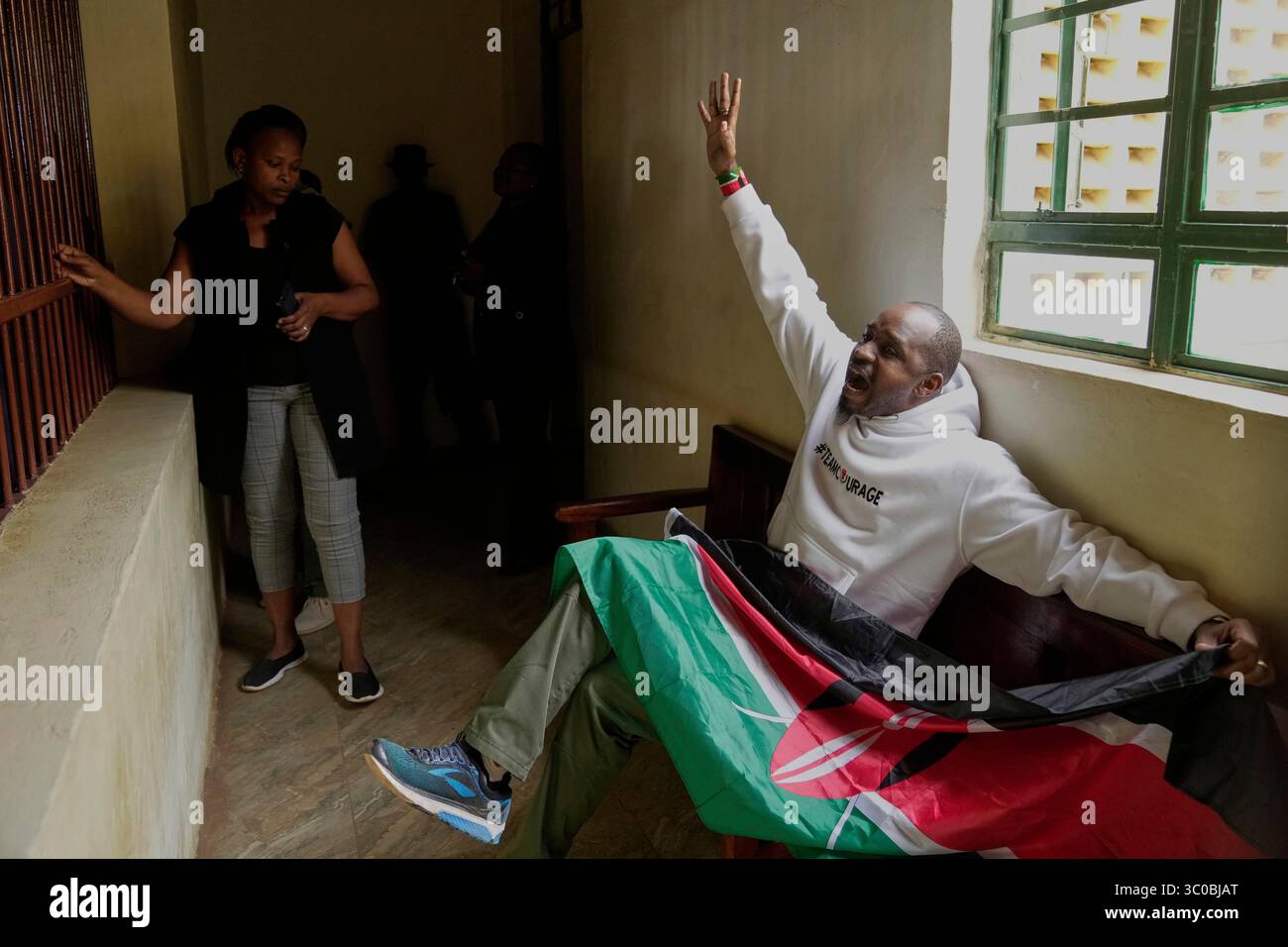 Prominent Kenyan activist Boniface Mwangi gestures inside the dock at ...