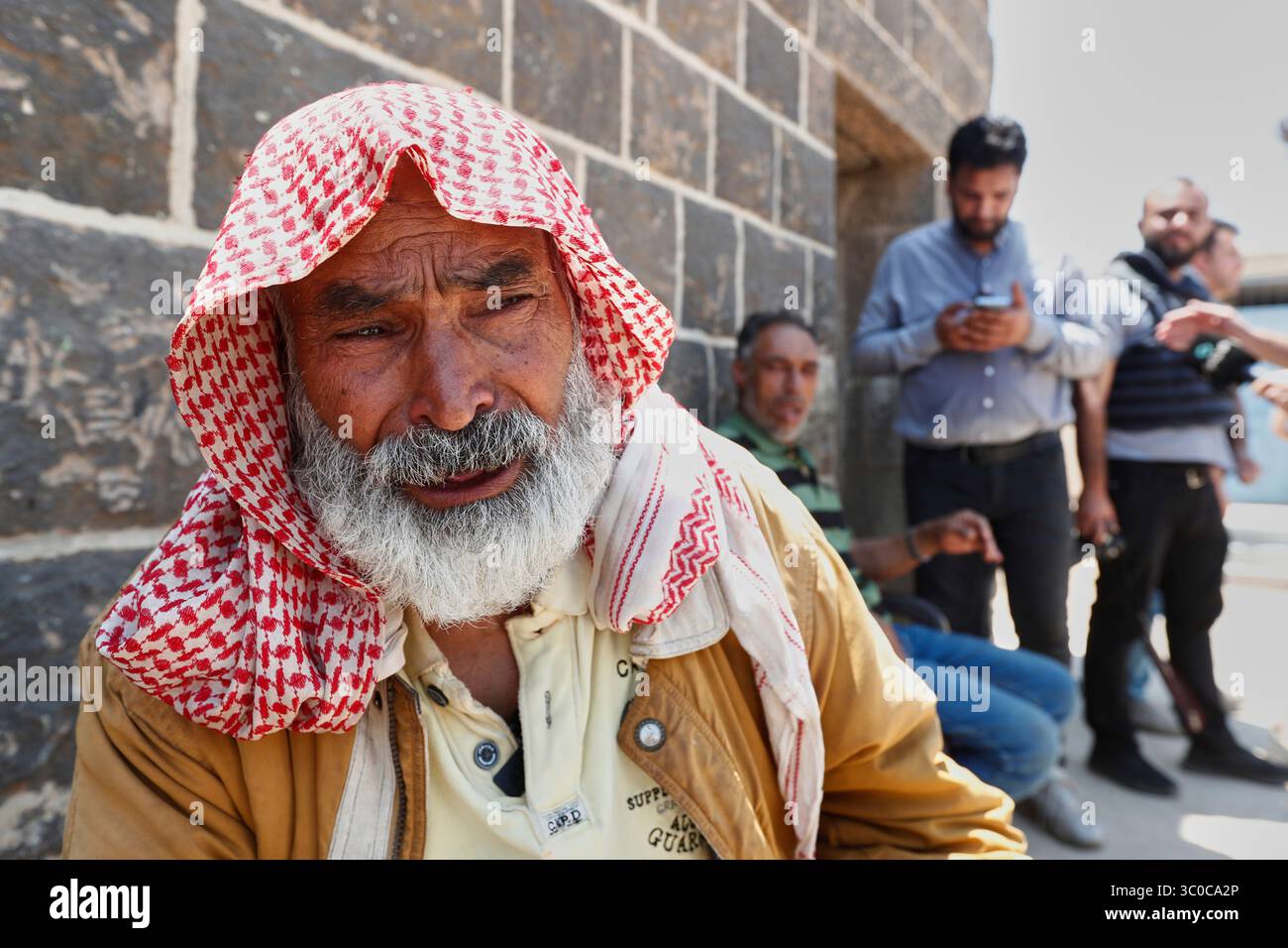 A displaced Bedouin man who fled his home in Shahba, a town in Syria's southern Sweida province ...