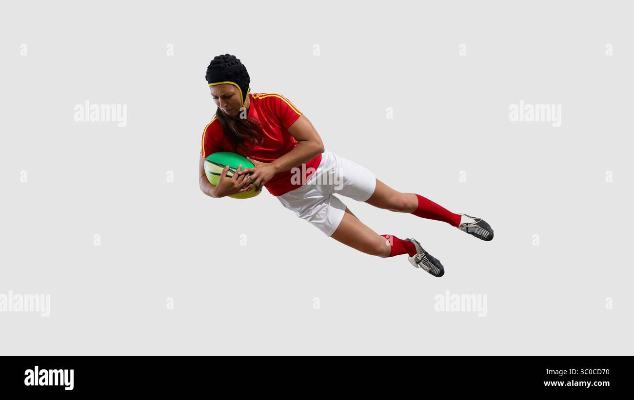 Female rugby player leaping with ball in mid-air action pose Stock ...