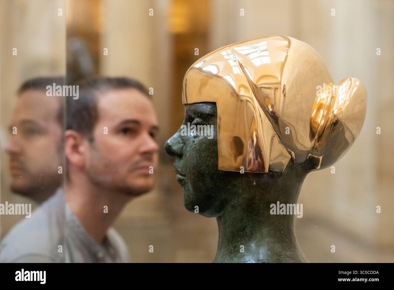 London, UK. 21 July 2025. A staff member with ‘Portrait of Iris ...