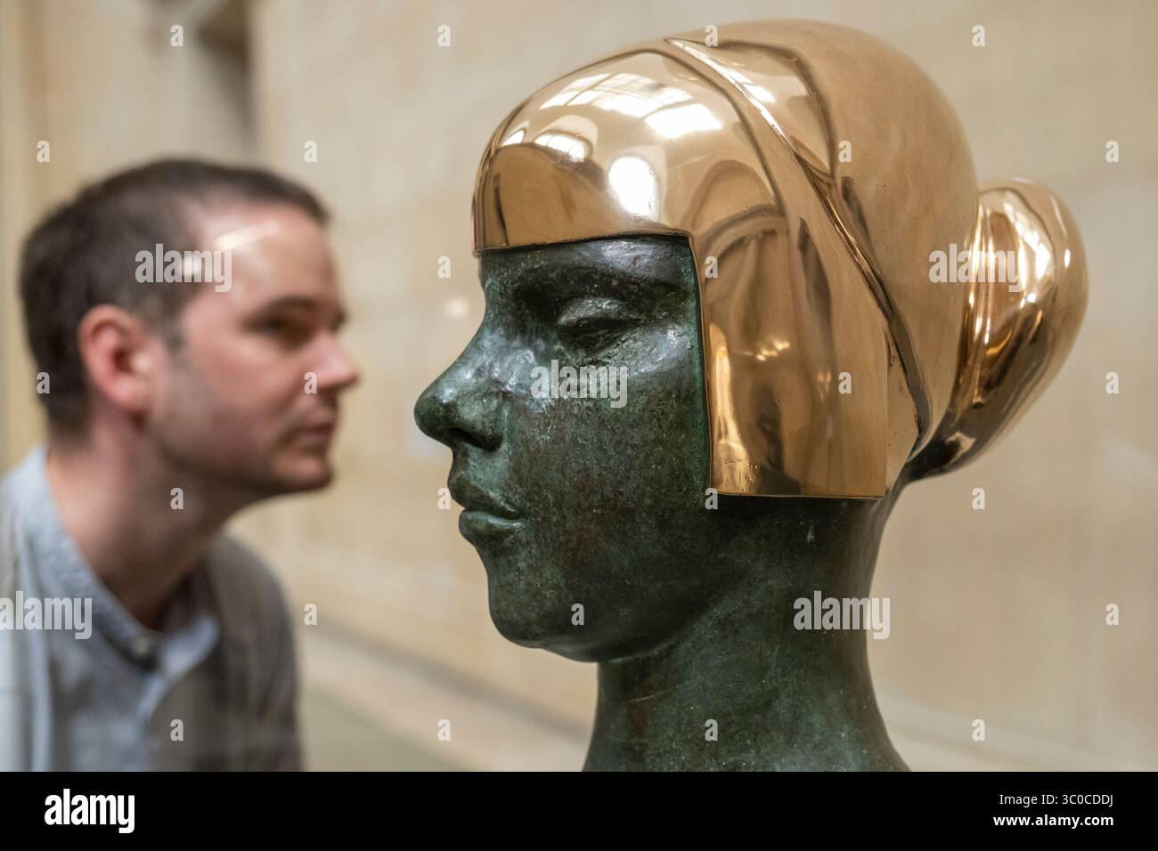 London, UK. 21 July 2025. A staff member with ‘Portrait of Iris ...