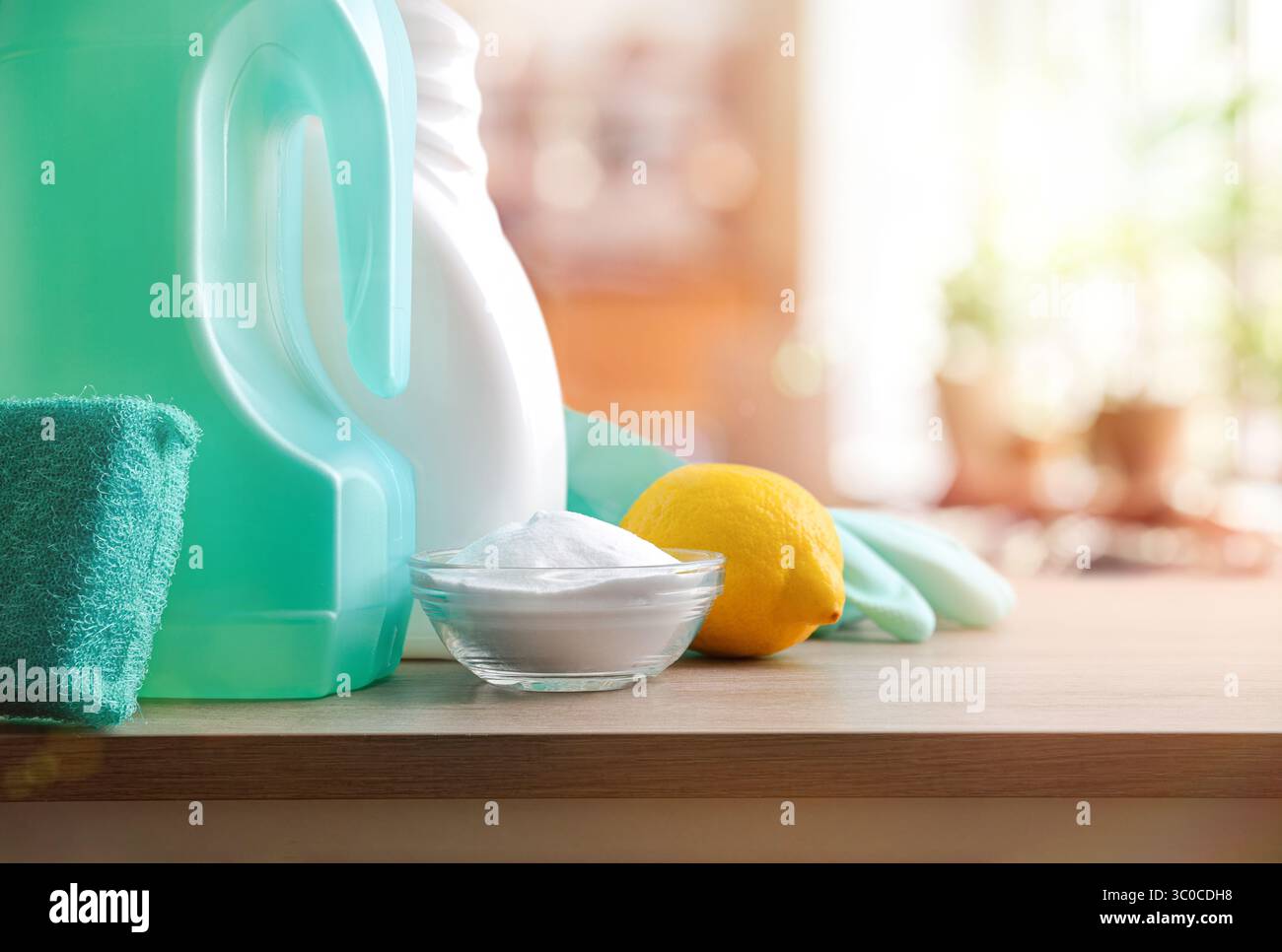 Different types of cleaning products, both chemical and natural, on a ...