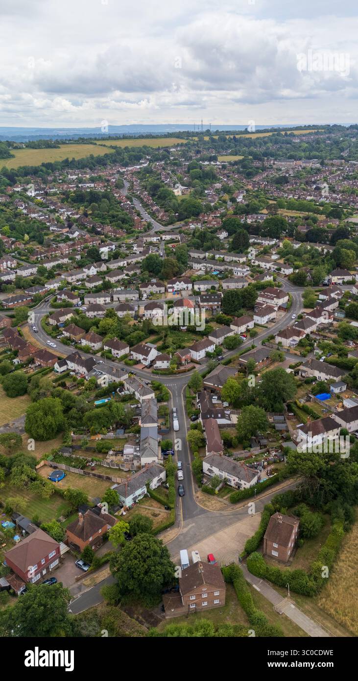 Aerial view of homes nestled among lush green trees, a suburban ...