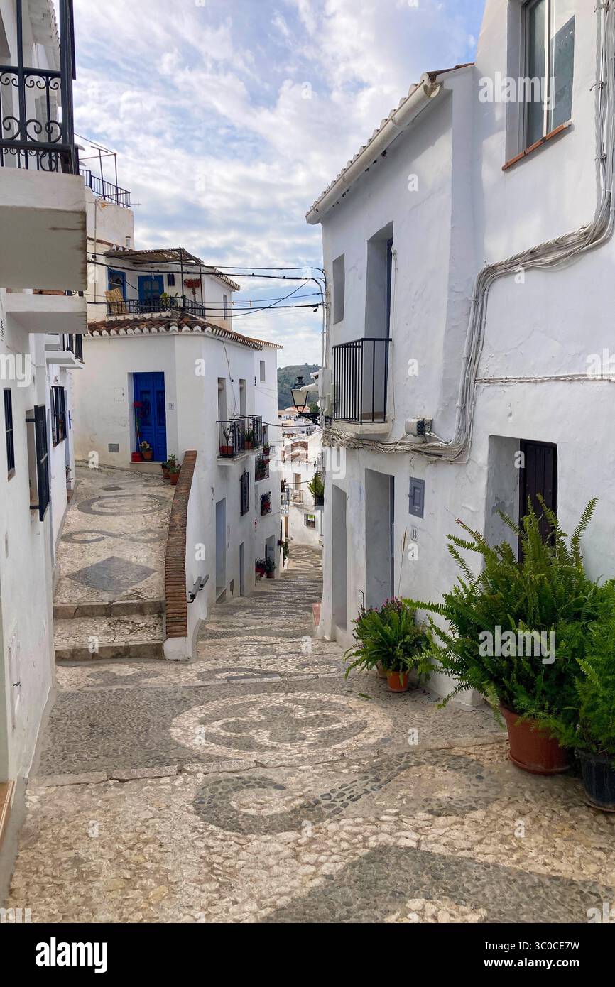 FRIGILIANA, SPAIN - MAY 10, 2025: A peaceful walk through the charming ...