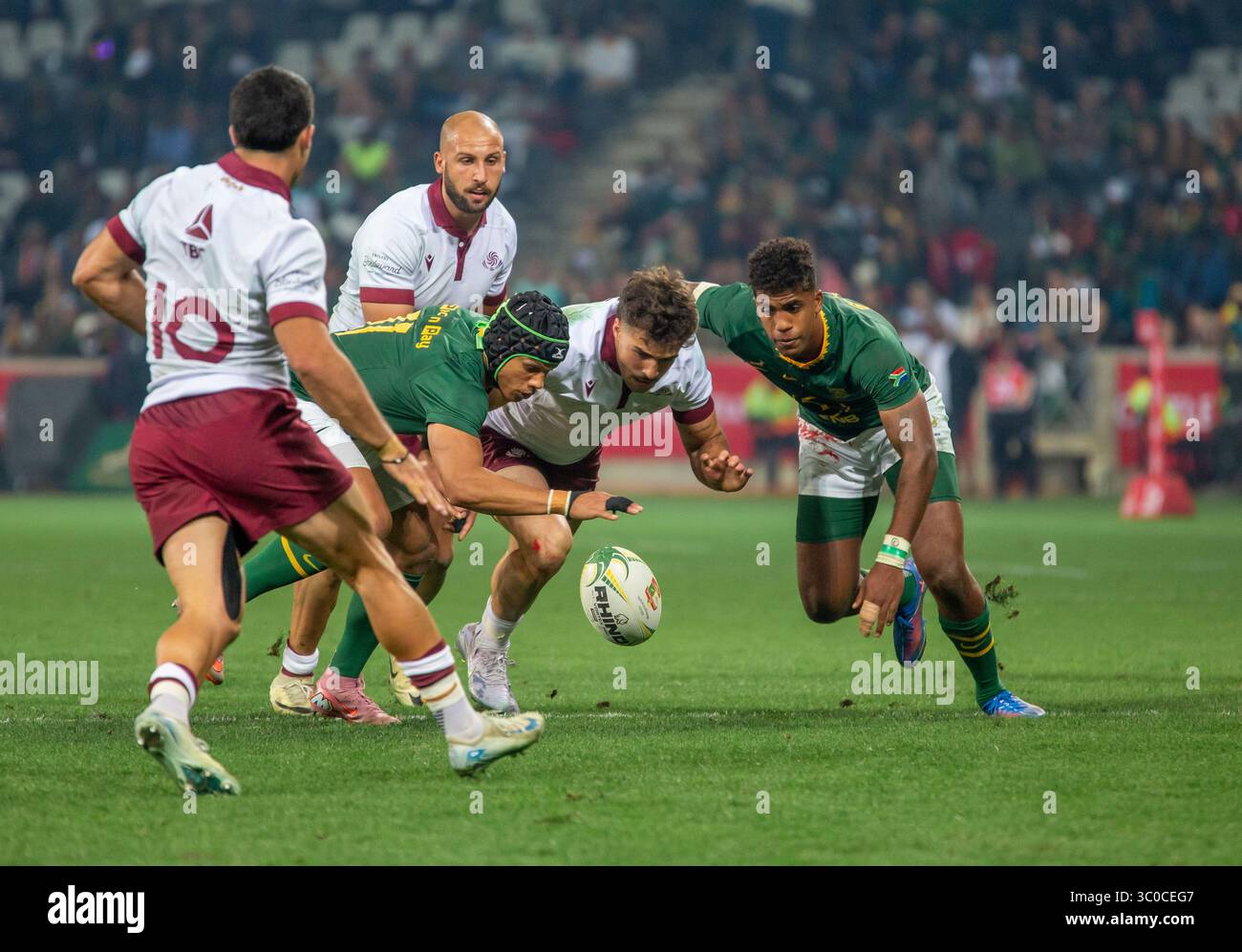 Kurt-Lee Arends and Canan Moodie contest a loose ball during the 2025 ...